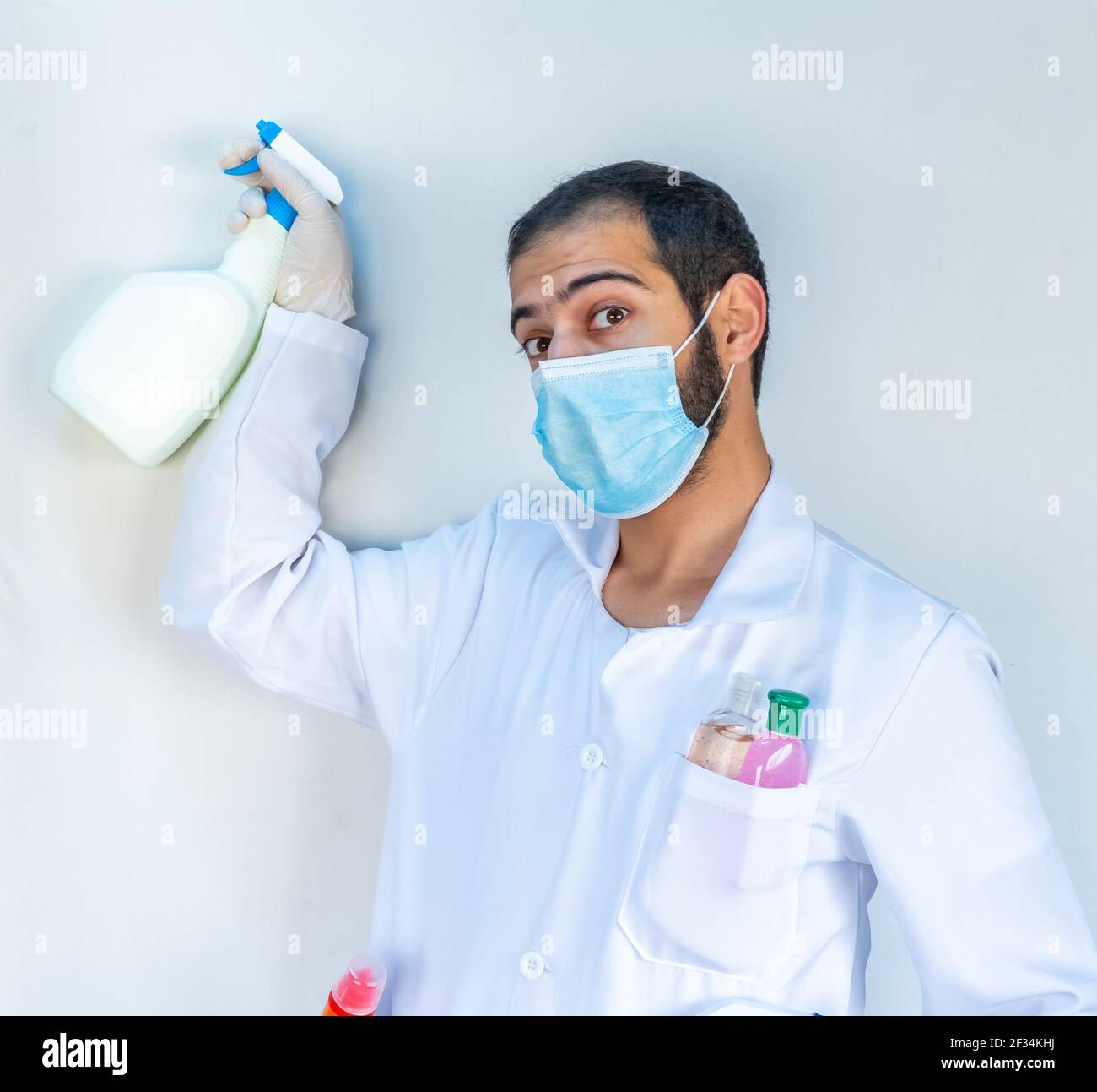 Arabic Muslim, a doctor holding many hygiene products Stock Photo - Alamy