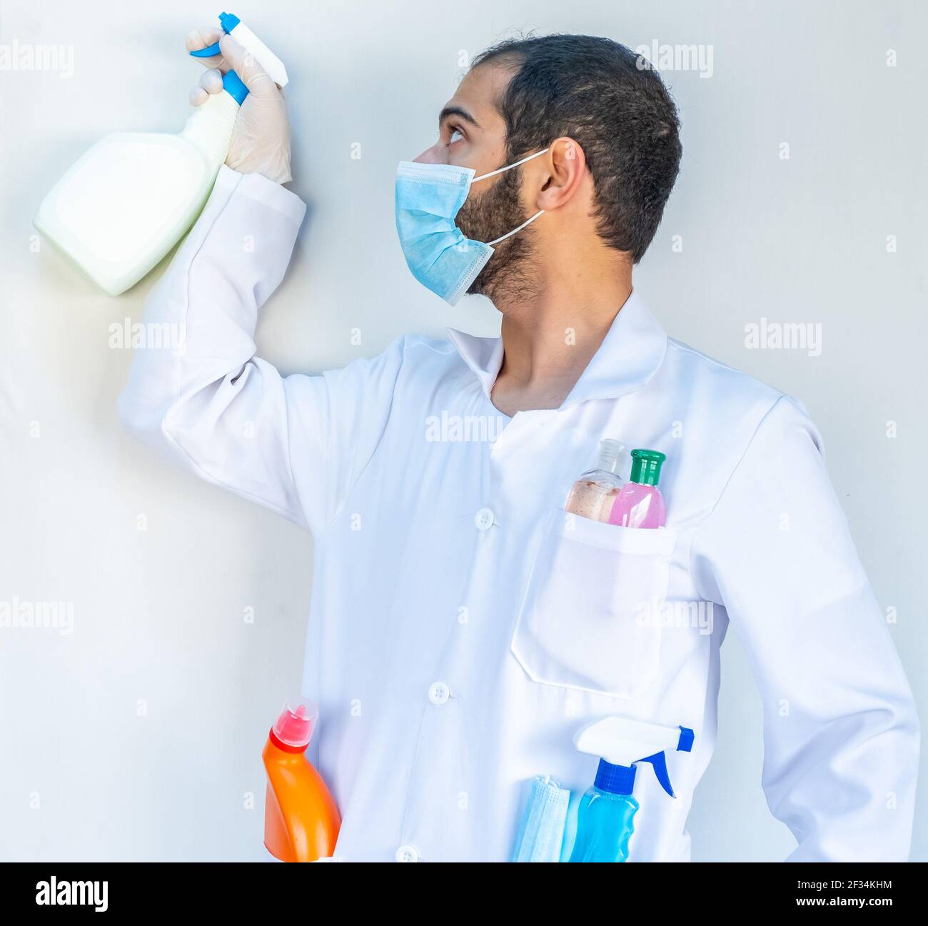Arabic Muslim, a doctor holding many hygiene products Stock Photo - Alamy