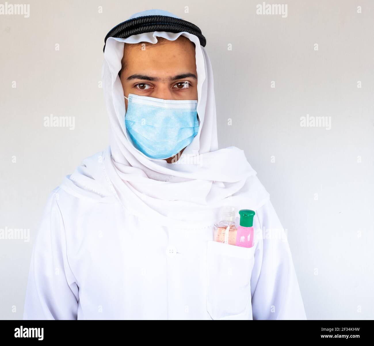 Arabic Muslim doctor wearing a mask with hygiene products Stock Photo ...