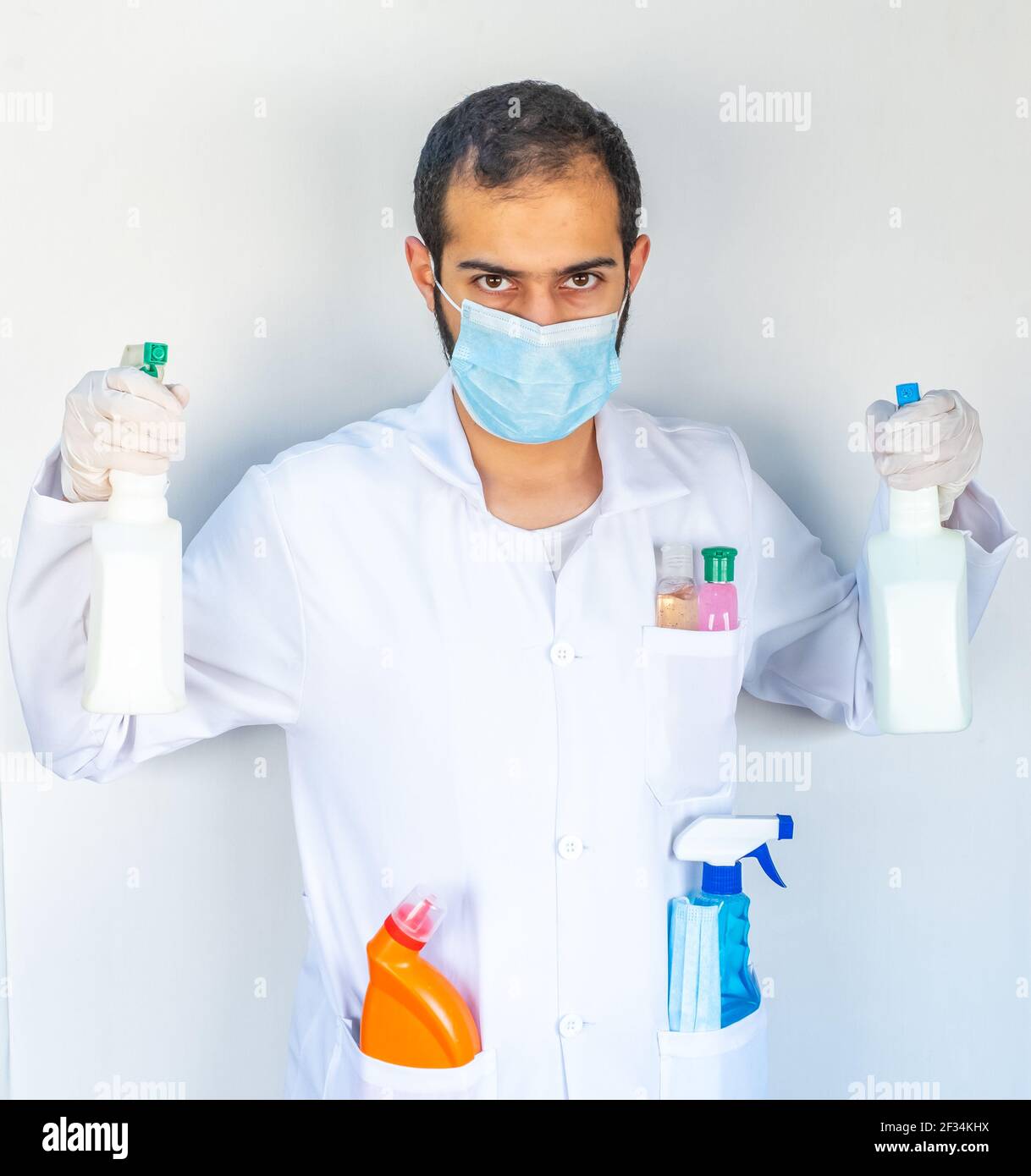 Arabic Muslim, a doctor holding many hygiene products Stock Photo - Alamy