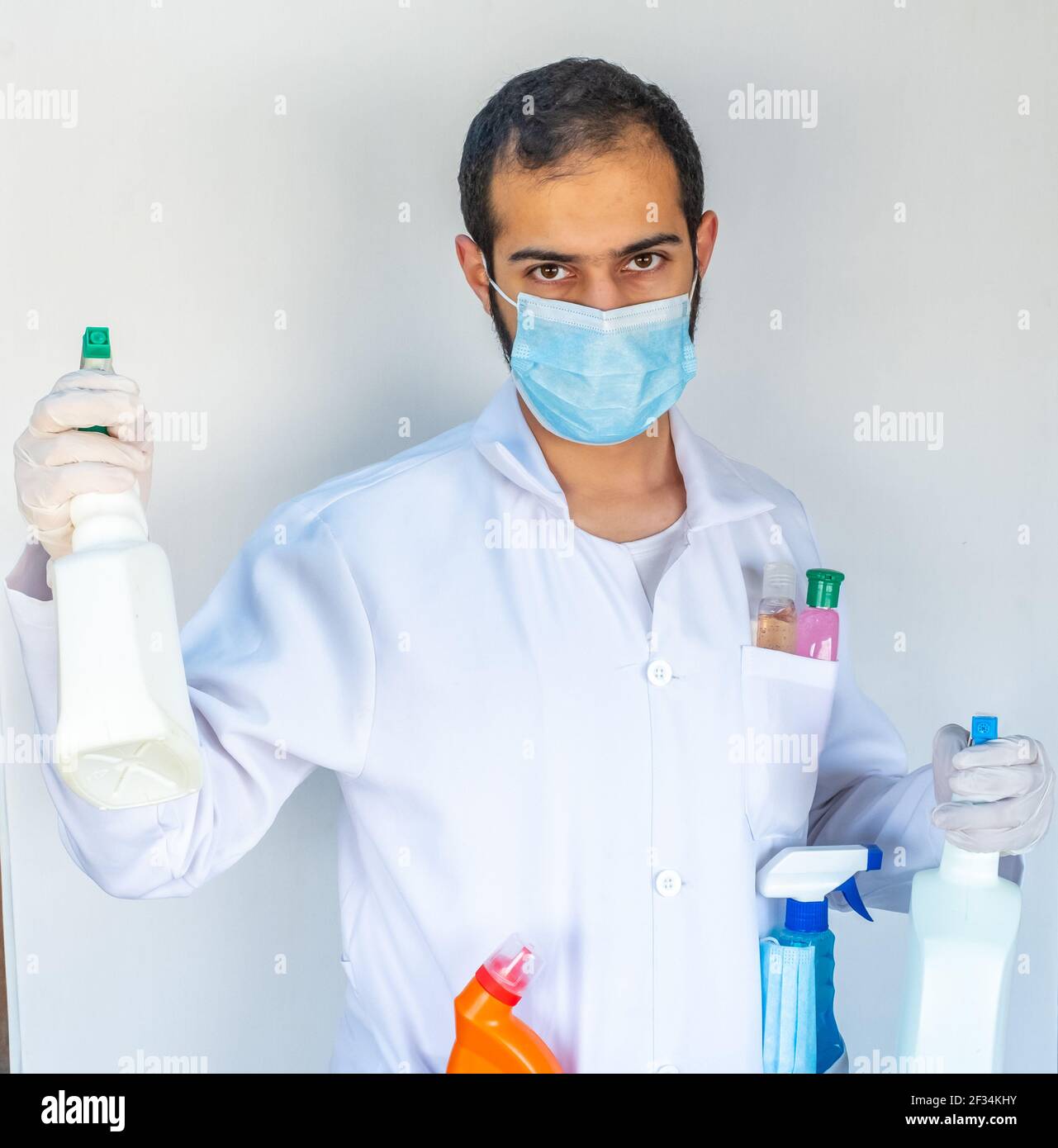 Arabic Muslim, a doctor holding many hygiene products Stock Photo - Alamy