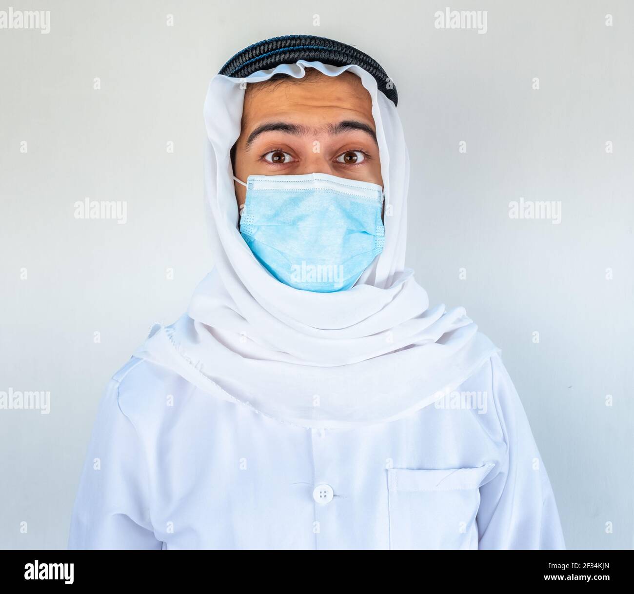 Arabic Muslim doctor wearing a mask with hygiene products Stock Photo ...