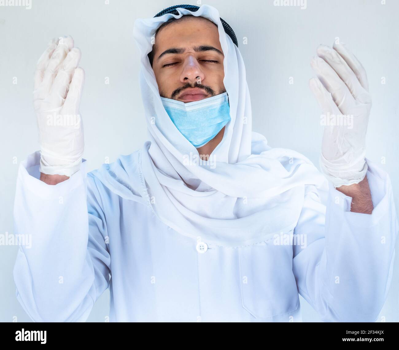 Arabic Muslim doctor praying for infected people Stock Photo - Alamy