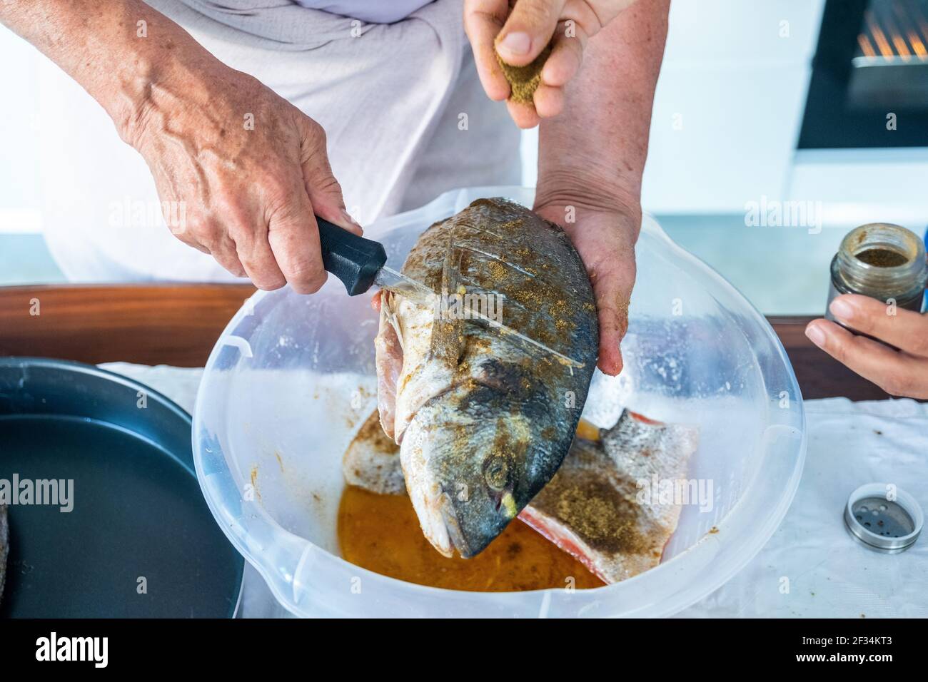 Raw meat being seasoned hi-res stock photography and images - Alamy