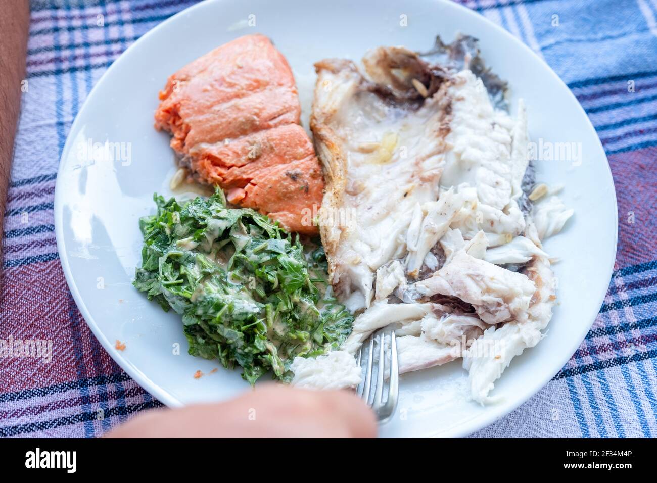 Family gathering to eat fish together Stock Photo - Alamy