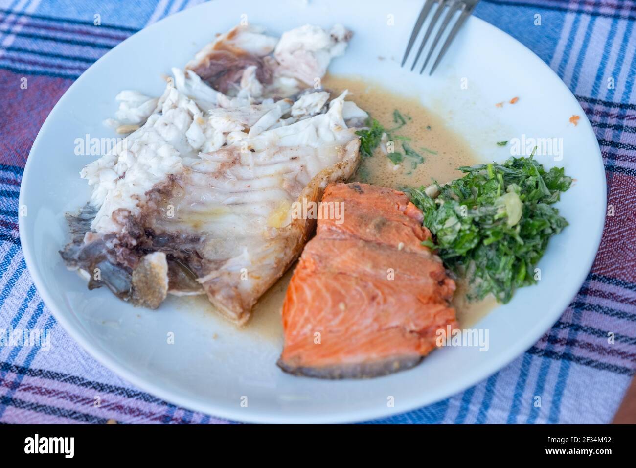 Family gathering to eat fish together Stock Photo - Alamy