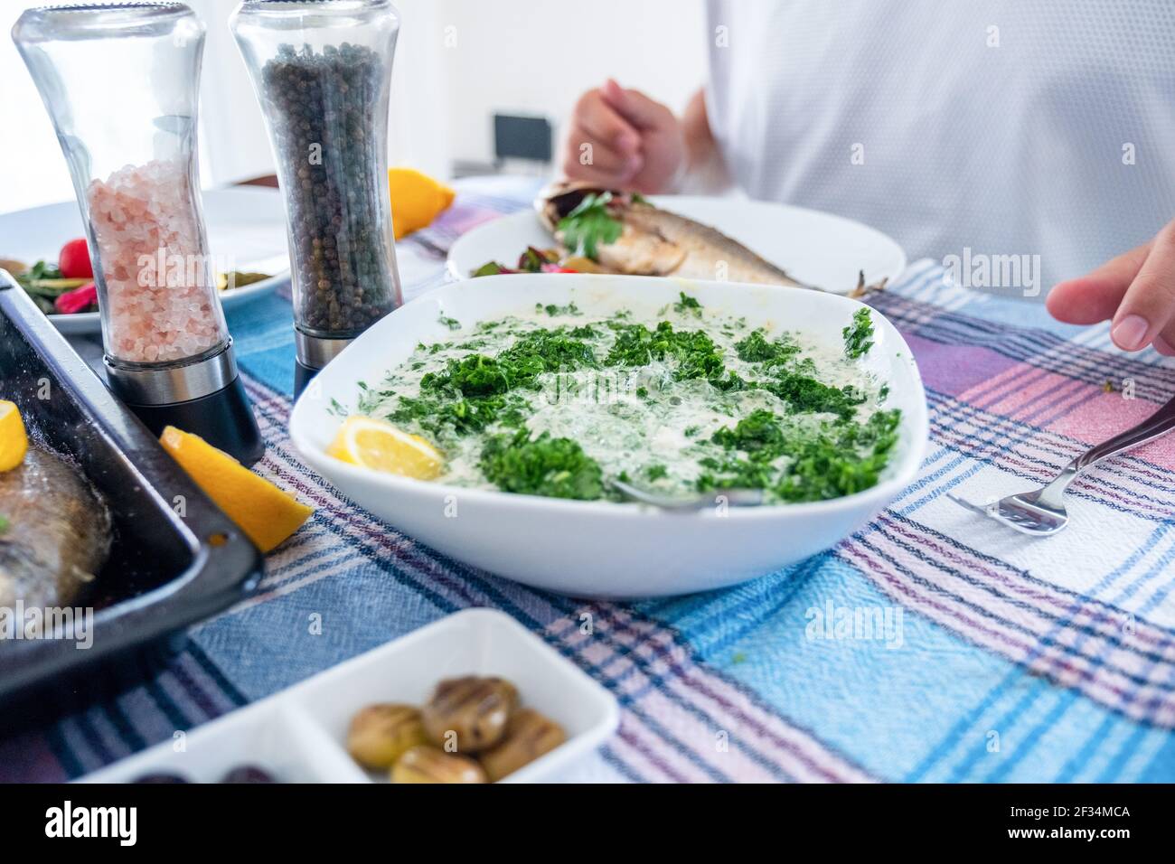 Family gathering to eat fish together Stock Photo - Alamy
