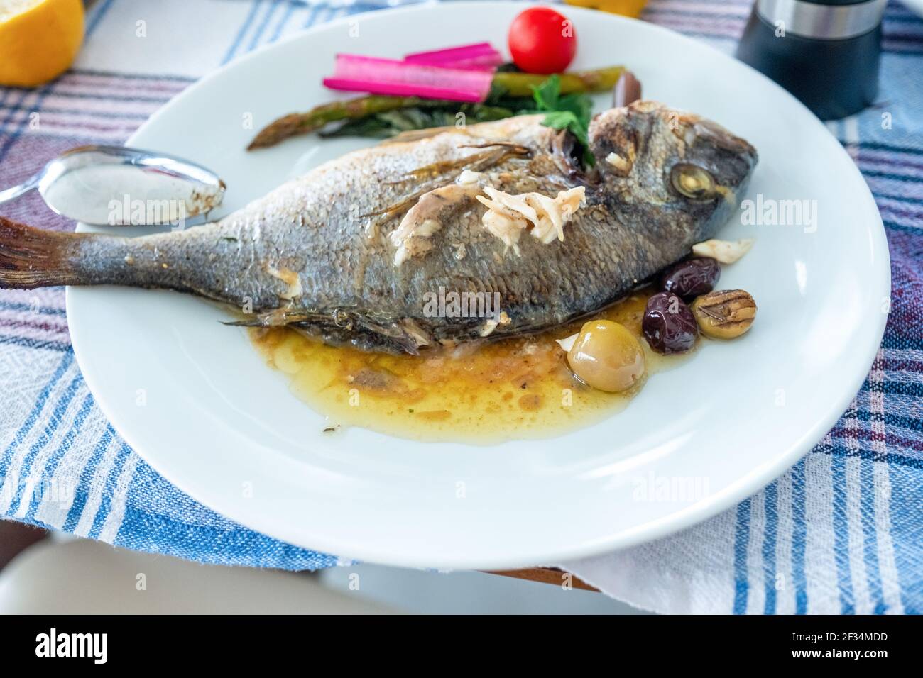 Family gathering to eat fish together Stock Photo - Alamy