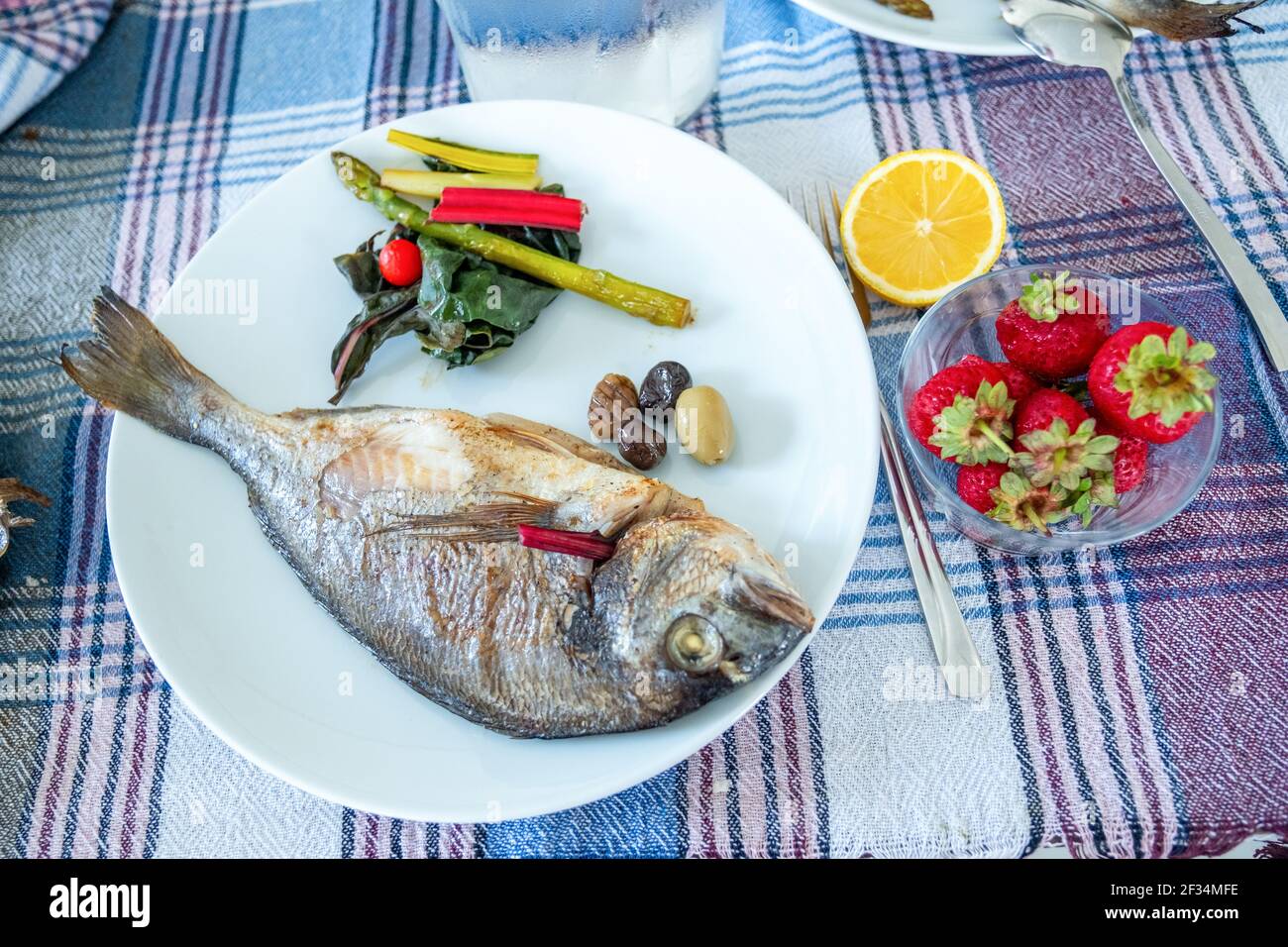 Family gathering to eat fish together Stock Photo - Alamy