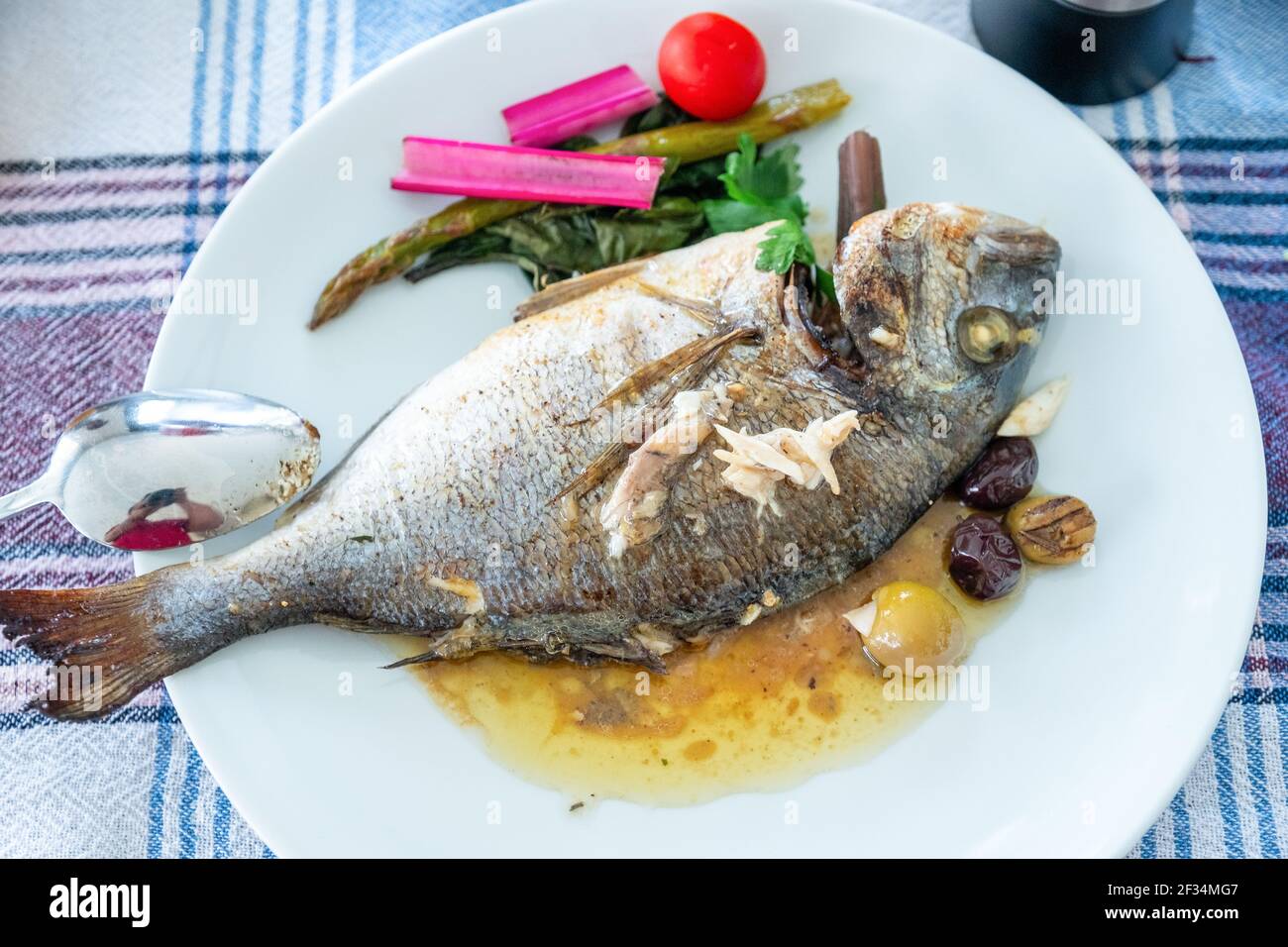 Family gathering to eat fish together Stock Photo - Alamy