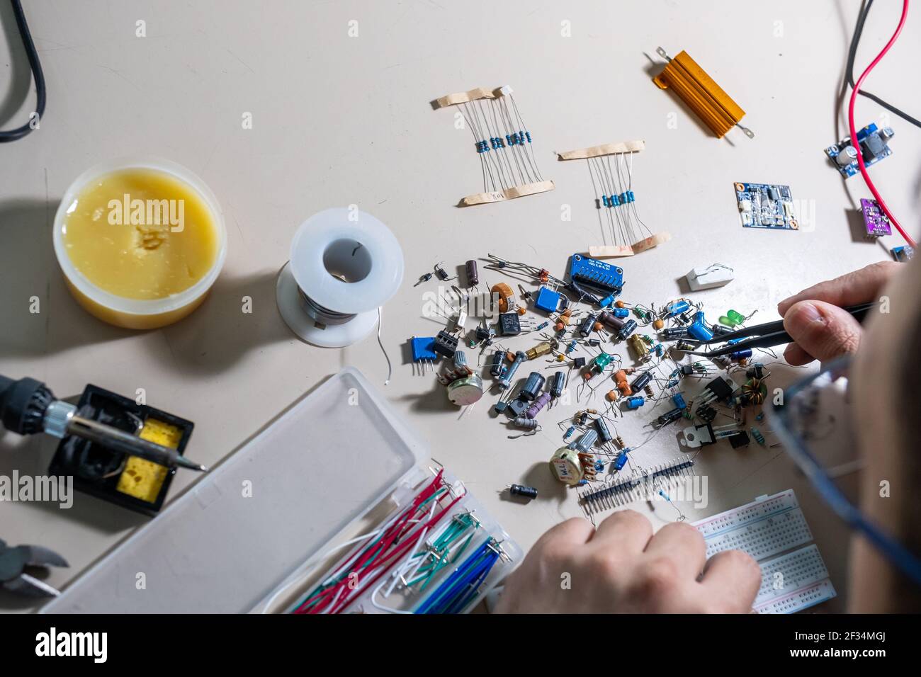 Guy holding electronic parts with his hand Stock Photo - Alamy
