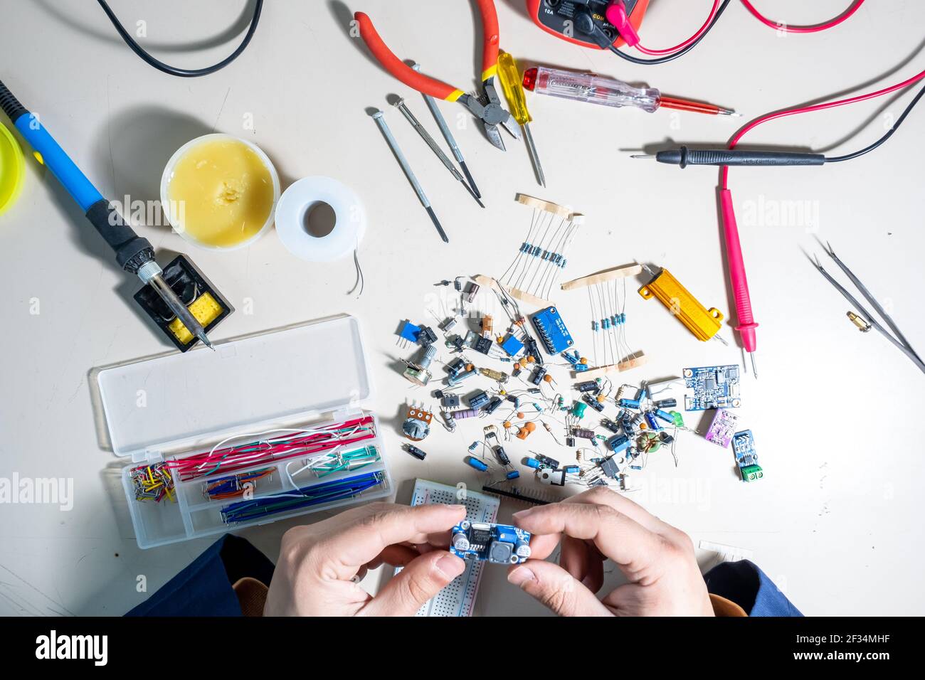 Guy holding electronic parts with his hand Stock Photo - Alamy