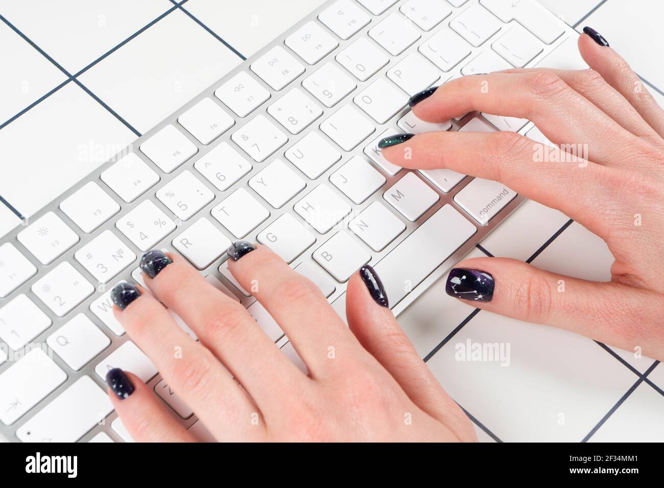Female hand using computer keyboard. Hand typing on desktop office ...