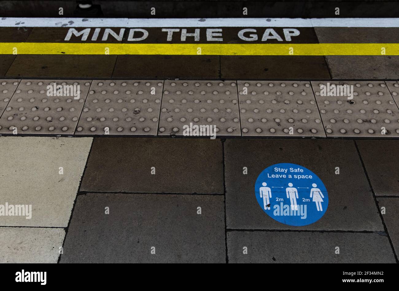 General view of sign on the floor on the London Underground for keeping ...