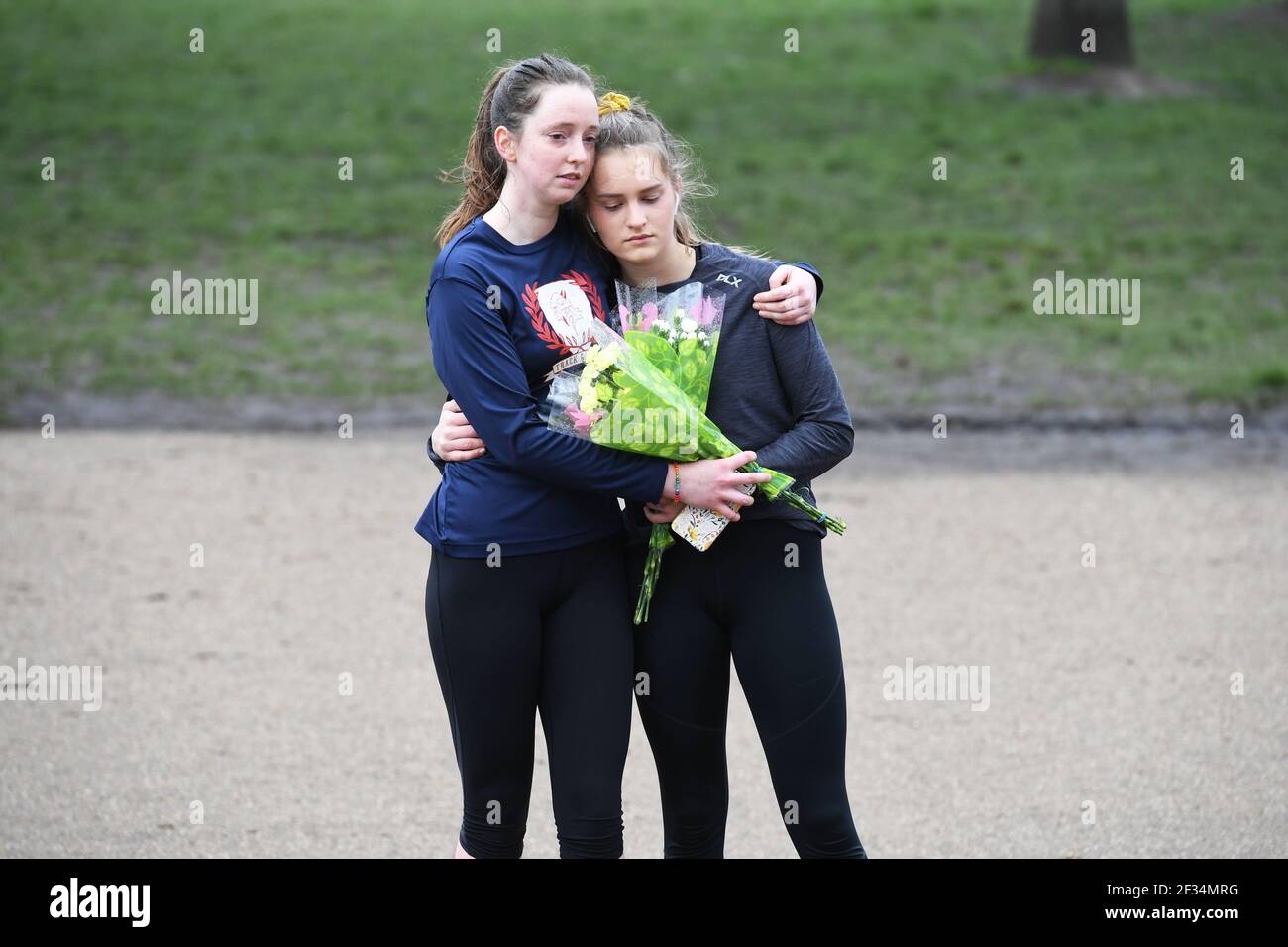 People leave floral tributes at the band stand in Clapham Common ...