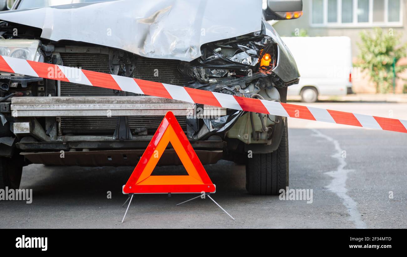 Red emergency stop triangle sign and Red warning police tape afore ...