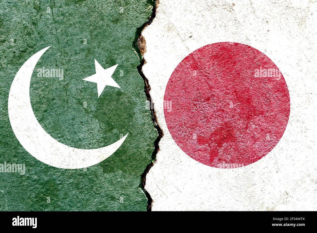 An overlay of the Pakistani and Japanese flags on a weathered cracked ...