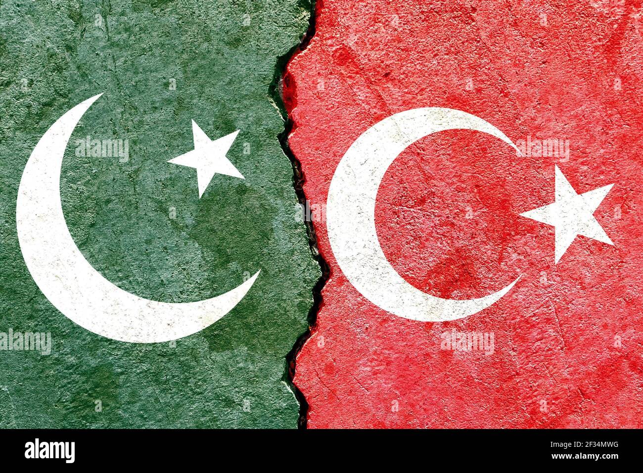An overlay of the Pakistani and Turkish flags on a weathered cracked ...