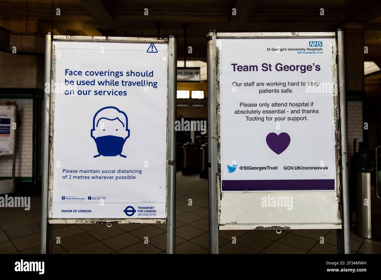 Messages at Tooting Broadway tube station for keeping 2 meters apart ...