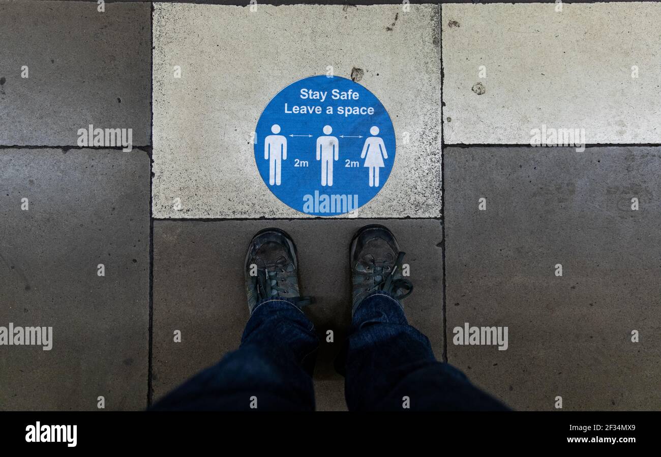 General view of sign on the floor on the London Underground for keeping ...
