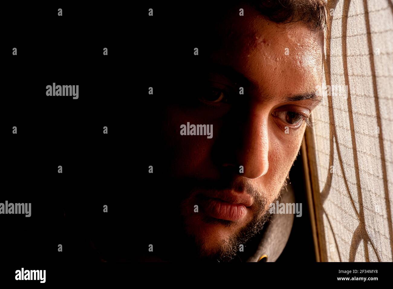 Arabic Muslim man head leaning on the window Stock Photo - Alamy