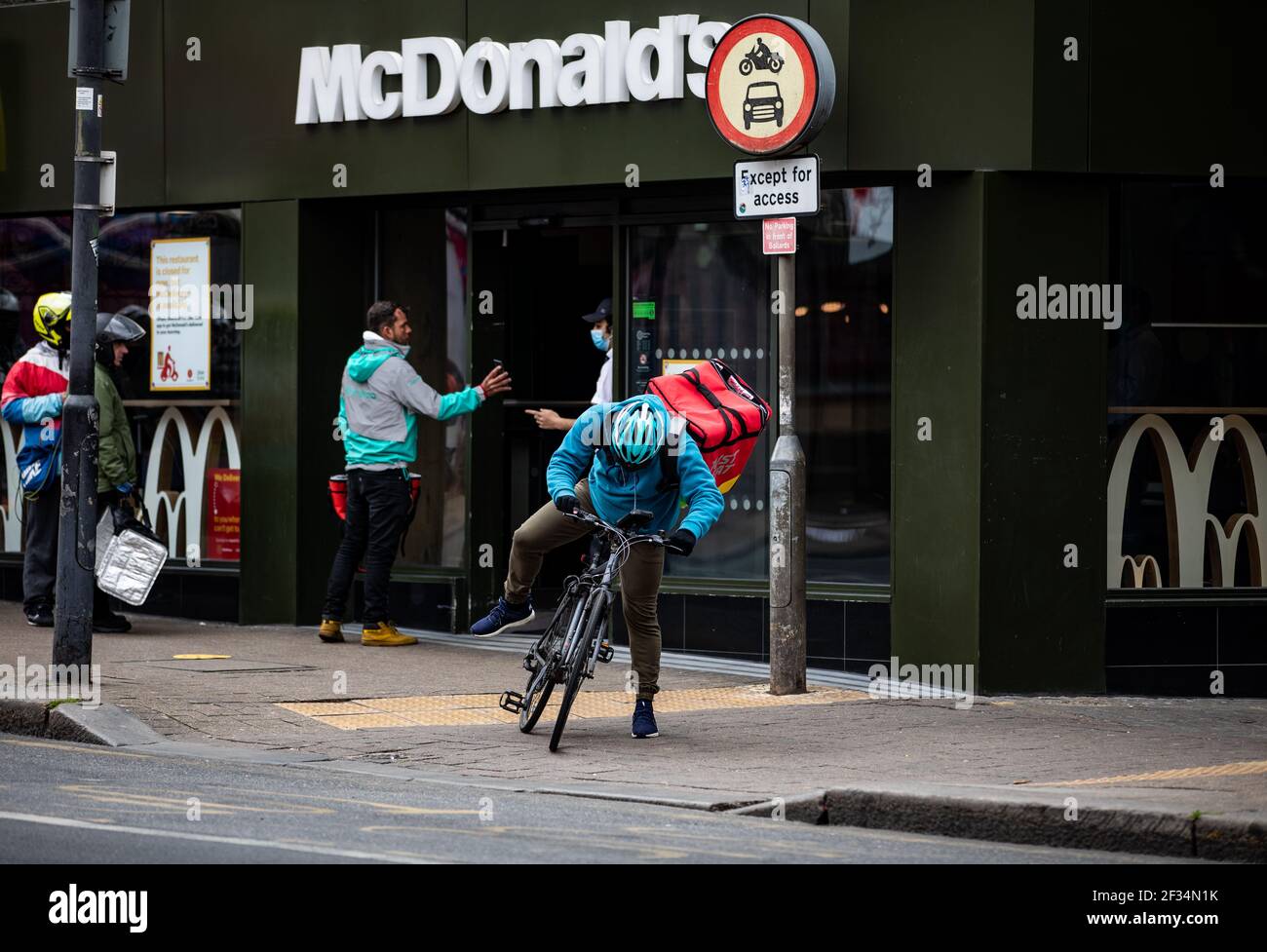Delivery riders waiting outside McDonald’s in Tooting, South London ...