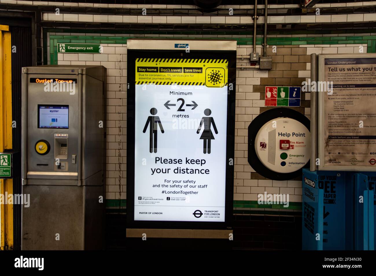 Messages at Tooting Broadway tube station for keeping 2 meters apart ...