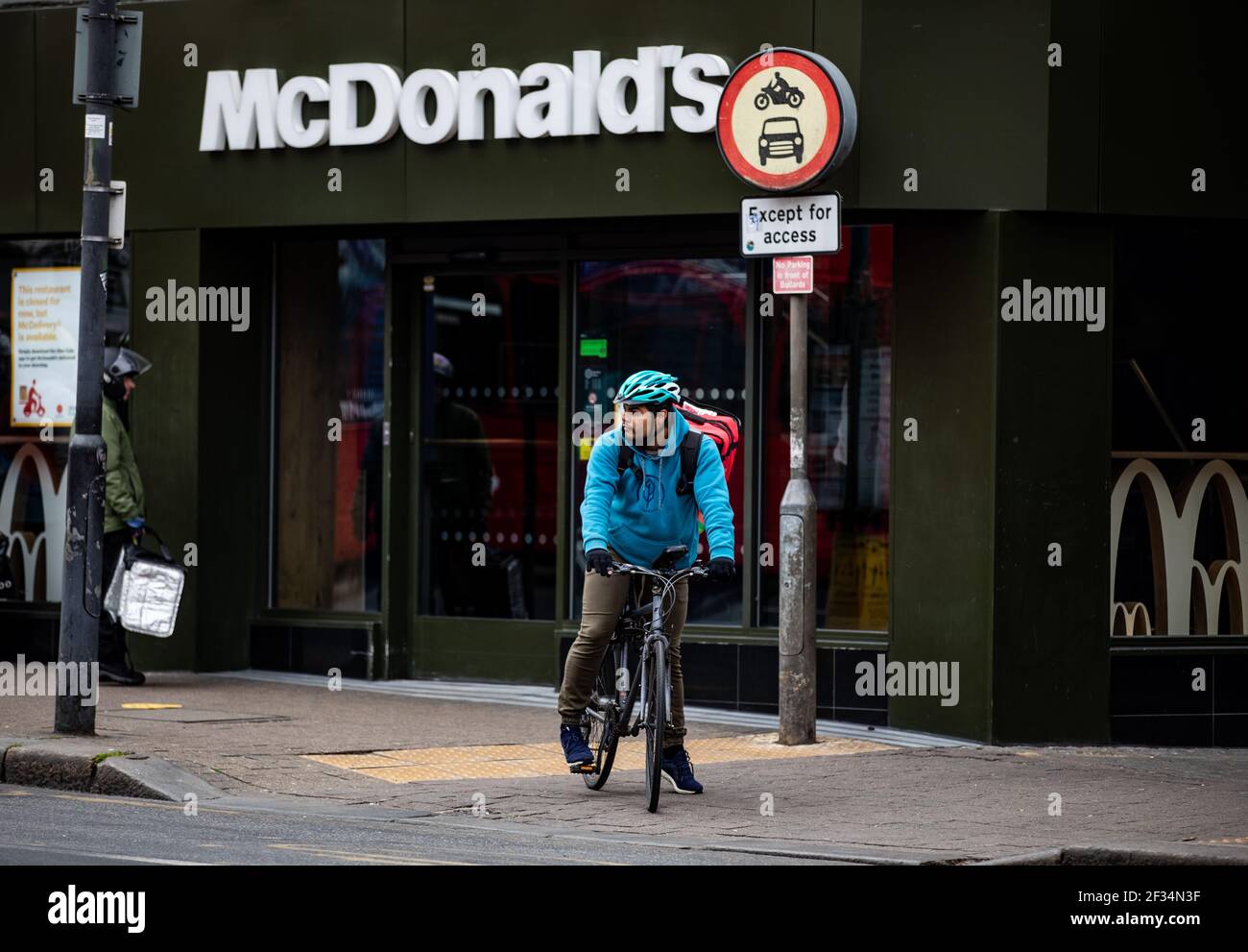 Delivery riders waiting outside McDonald’s in Tooting, South London waiting to food collections ...