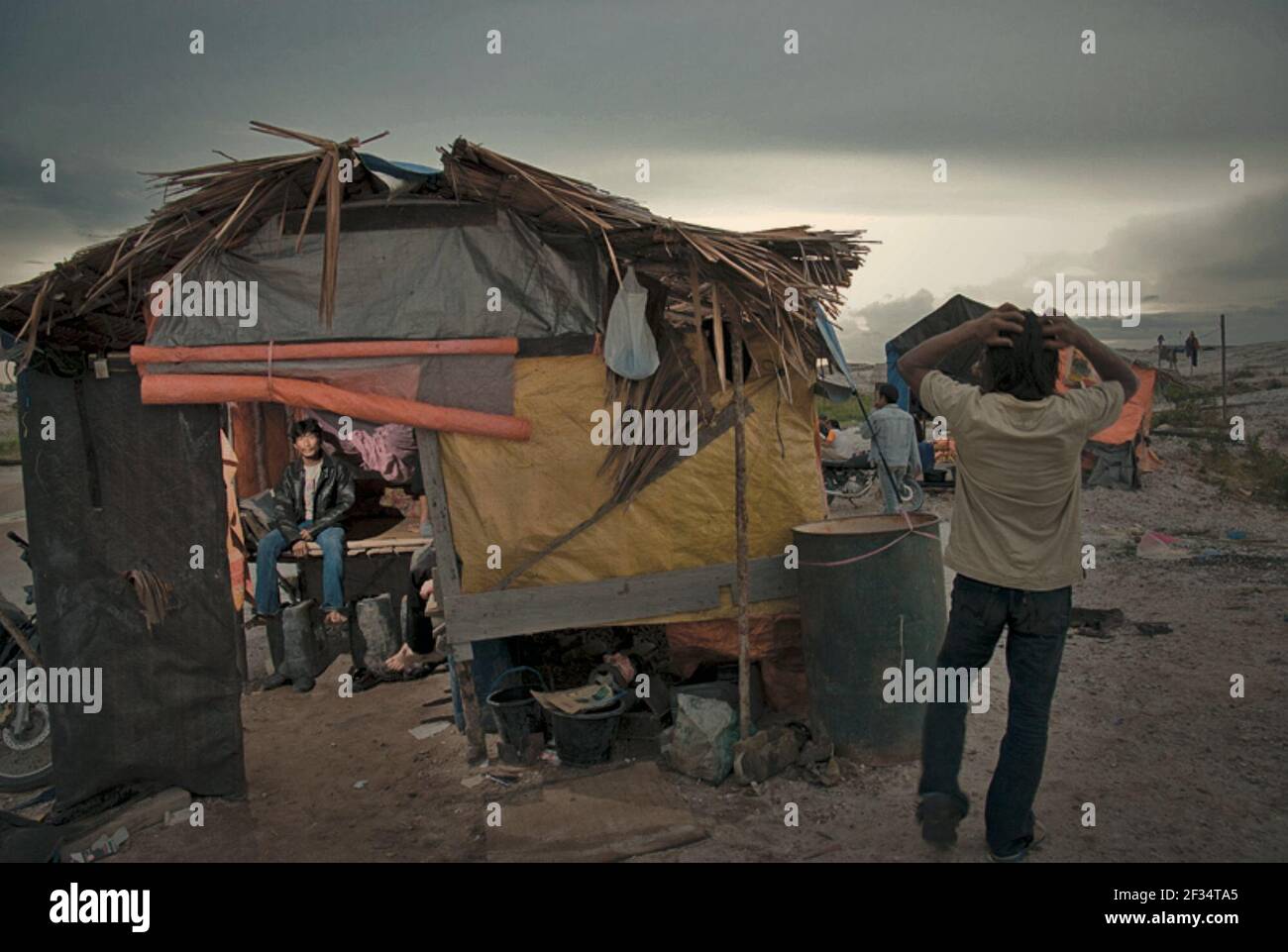 Members of a traditional gold mining team having a leisure time at ...