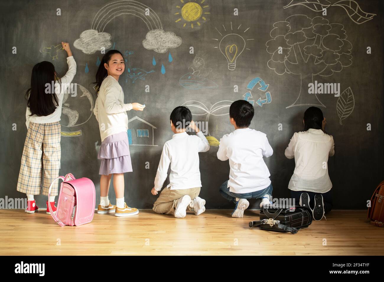 Children Drawing on a Blackboard Stock Photo - Alamy