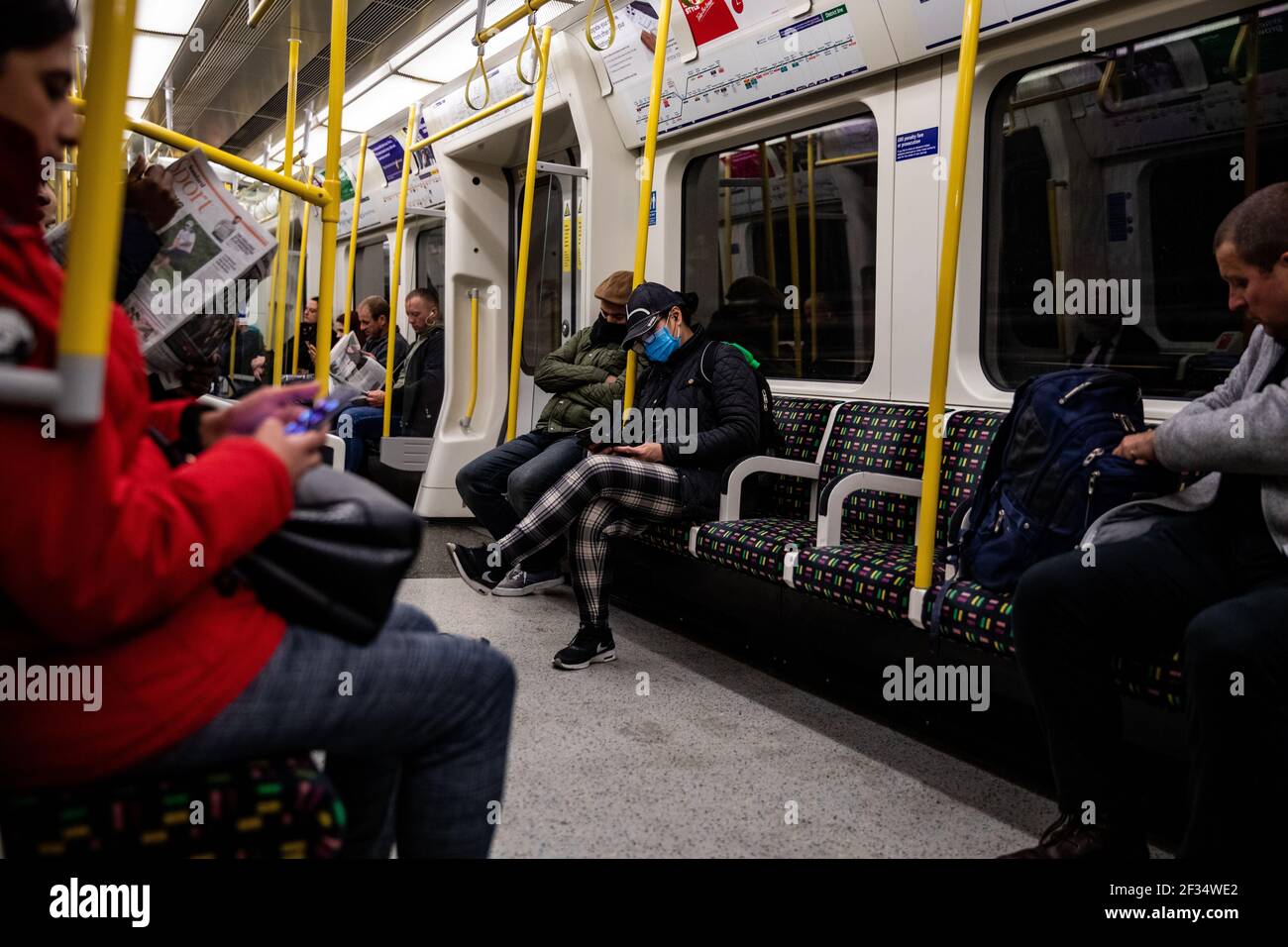 Members of the public on the District Line on the London Underground ...