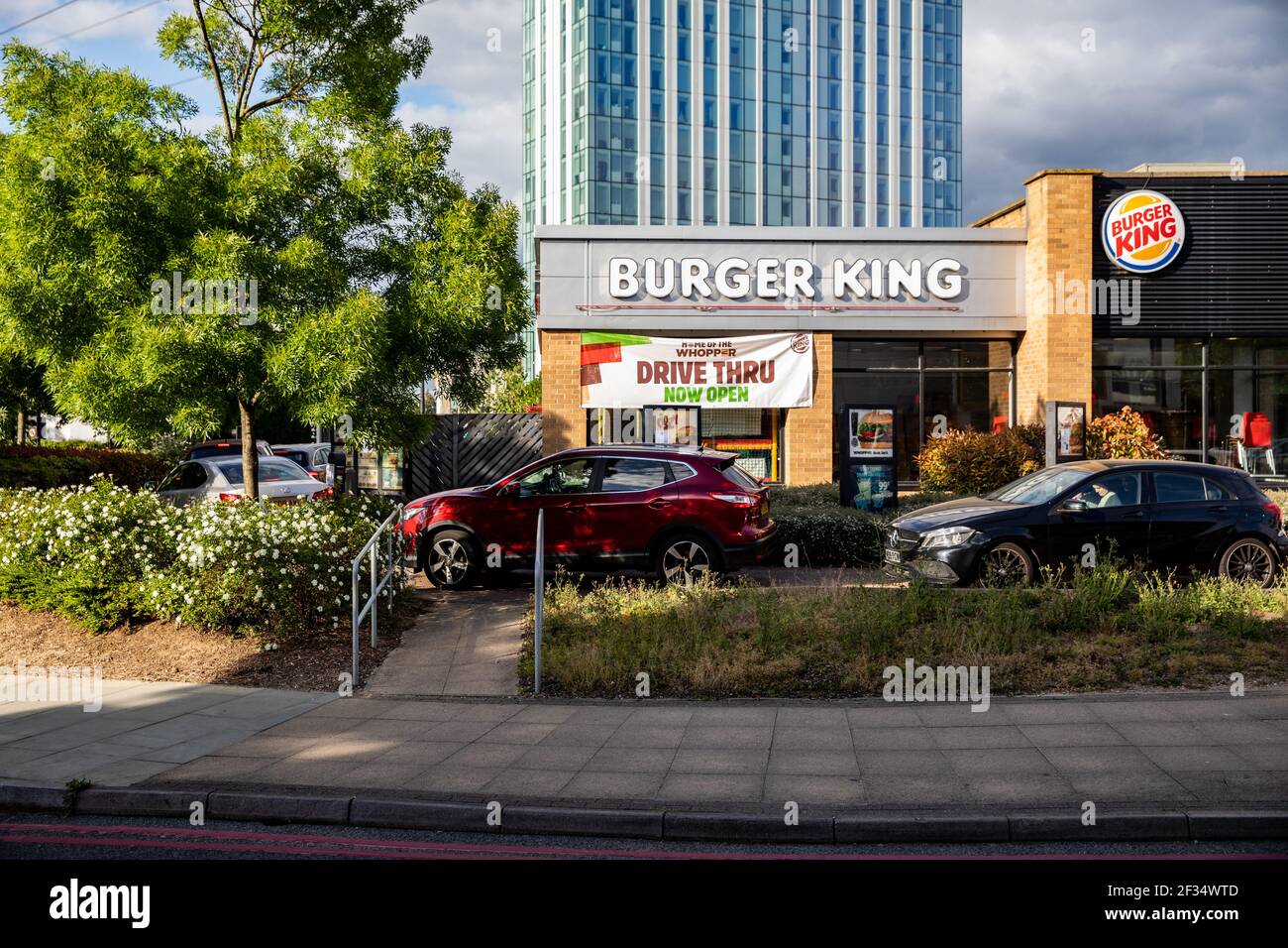People queuing up outside Burger King as it has reopen for drive ...