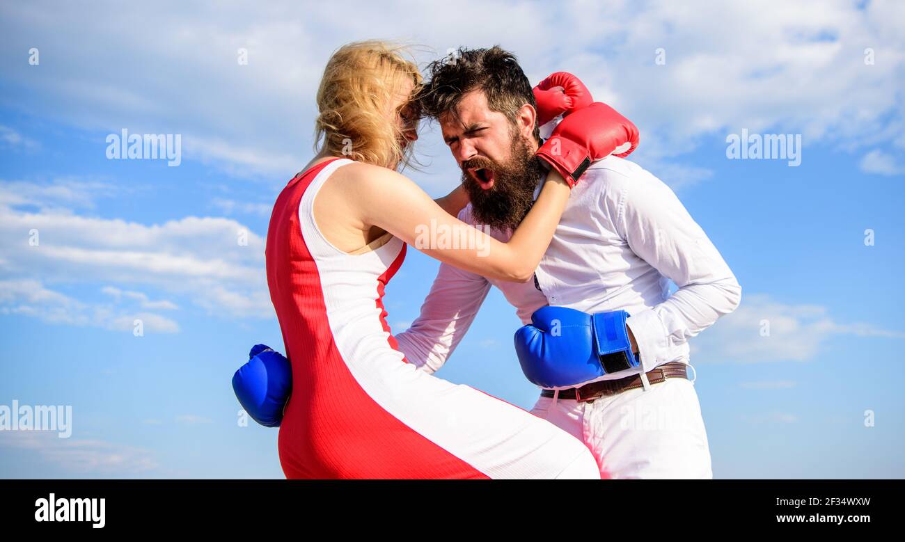 Defend your opinion in confrontation. Man and woman fight boxing gloves ...