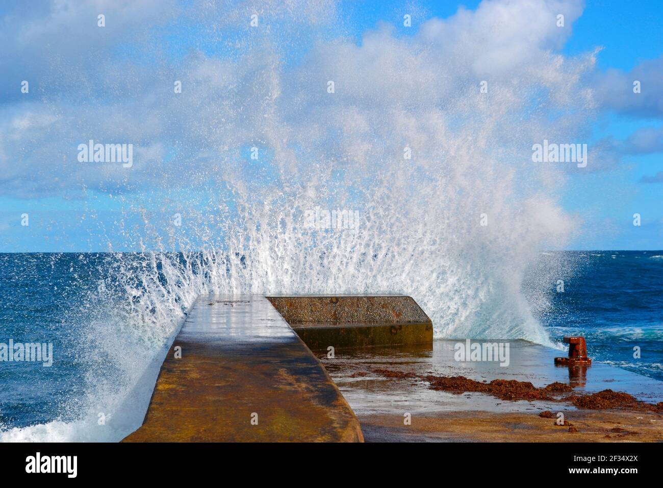 Water hitting concrete pier, wave of Atlantic ocean, Azores Stock Photo ...