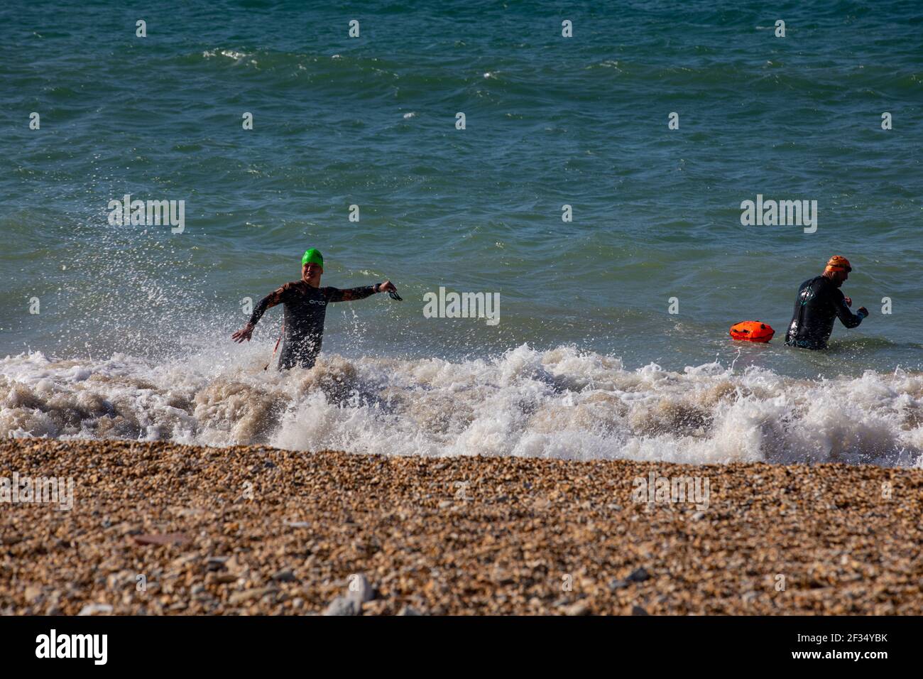 Swimmer getting in the sea in Bowleaze Cove in Weymouth in Dorset Stock ...