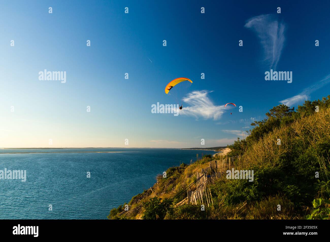 Paragliding on the beach Stock Photo - Alamy