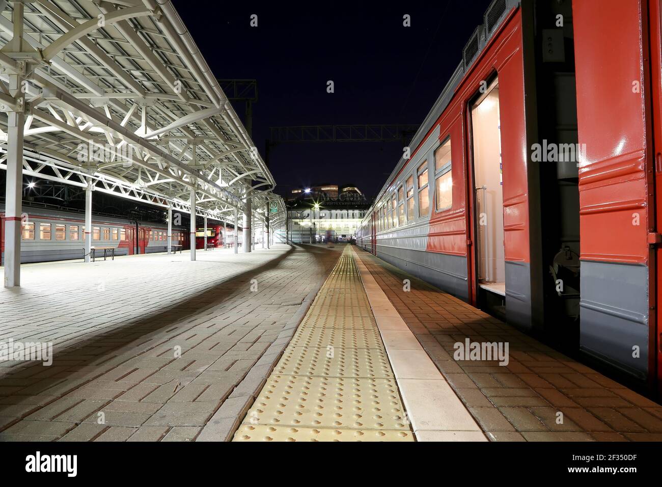Train on Moscow passenger platform at night (Belorussky railway station ...
