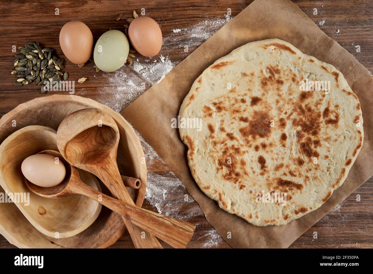 Flat bread with seeds fresh and hot from the frying pan Stock Photo - Alamy