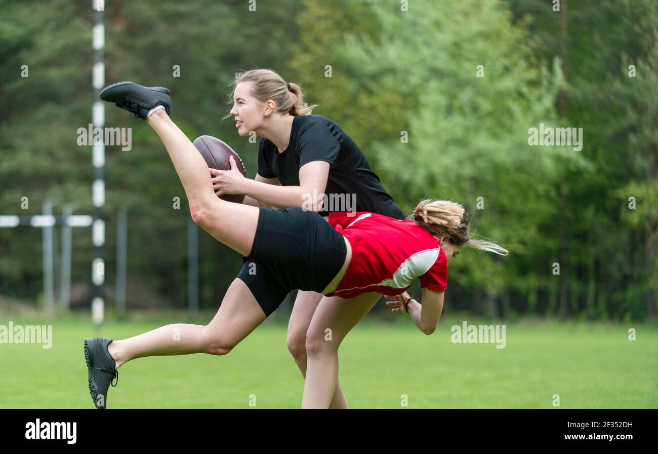 Girls playing rugby together outside in summer. Woman sport concept ...