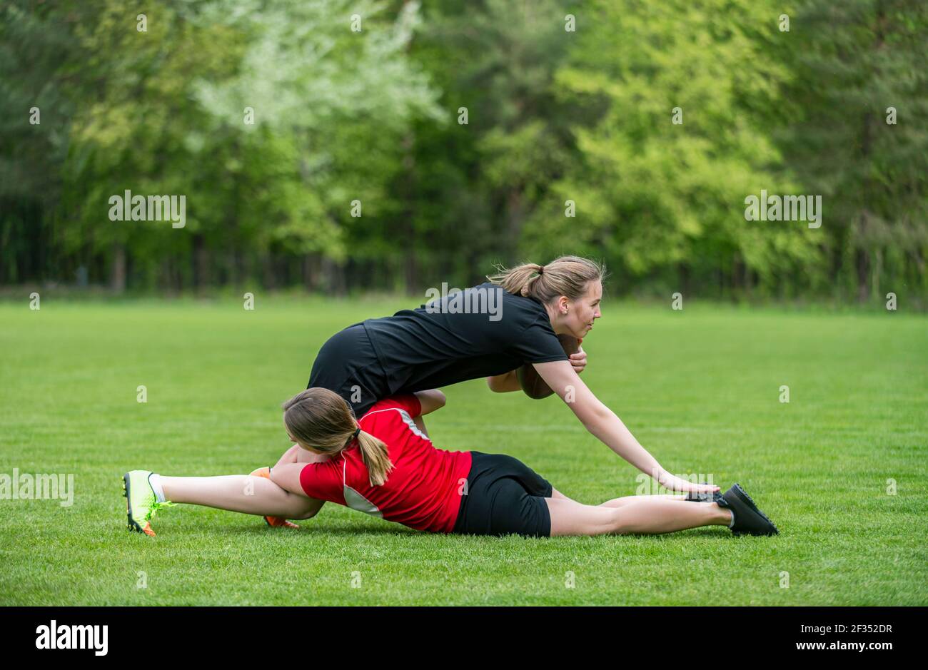Girls playing rugby together outside in summer. Woman sport concept ...