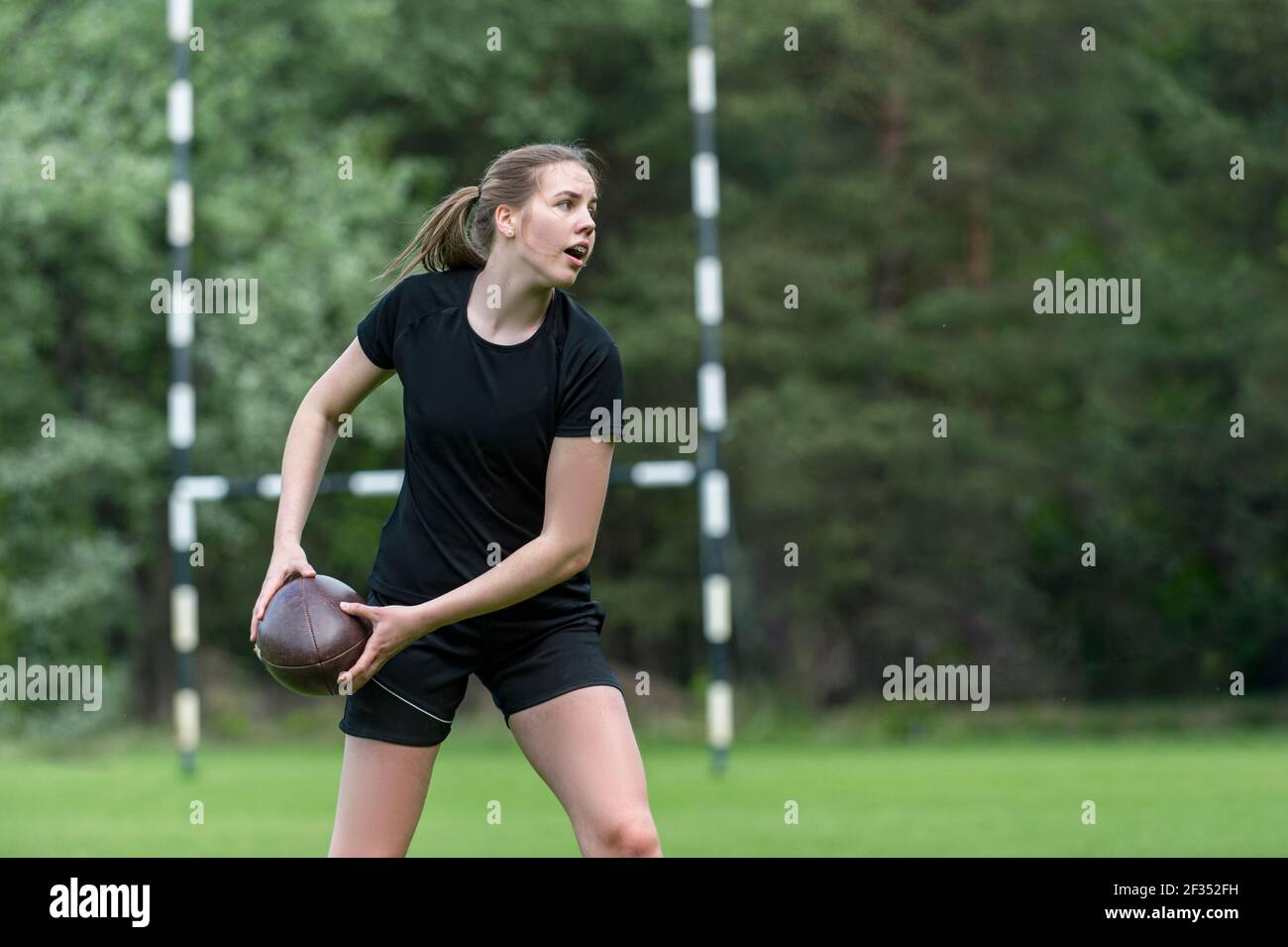 Girl playing rugby together outside in summer. Woman sport concept ...