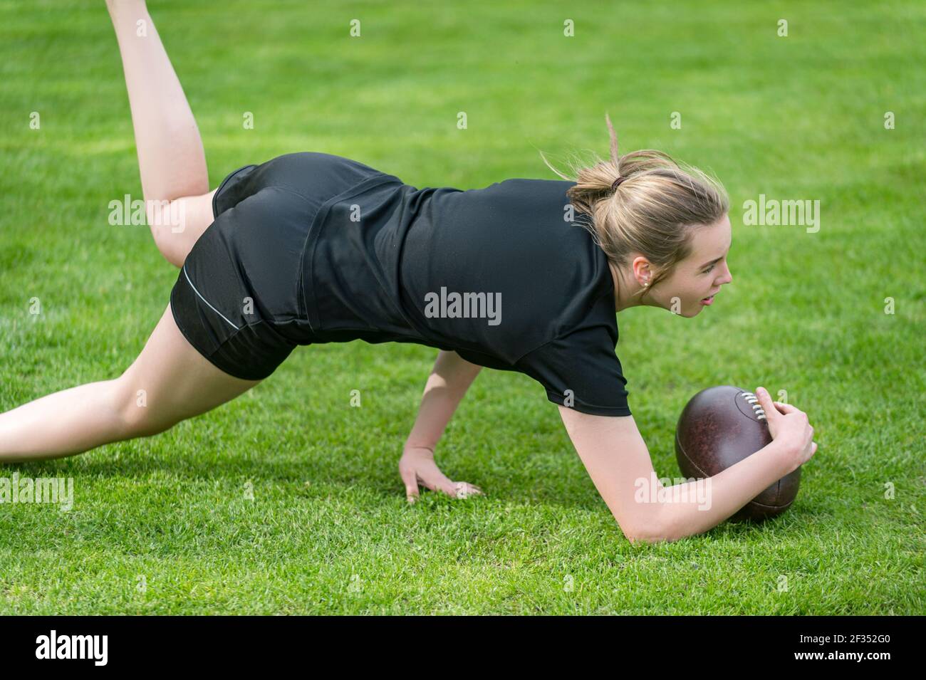 Girl playing rugby together outside in summer. Woman sport concept ...