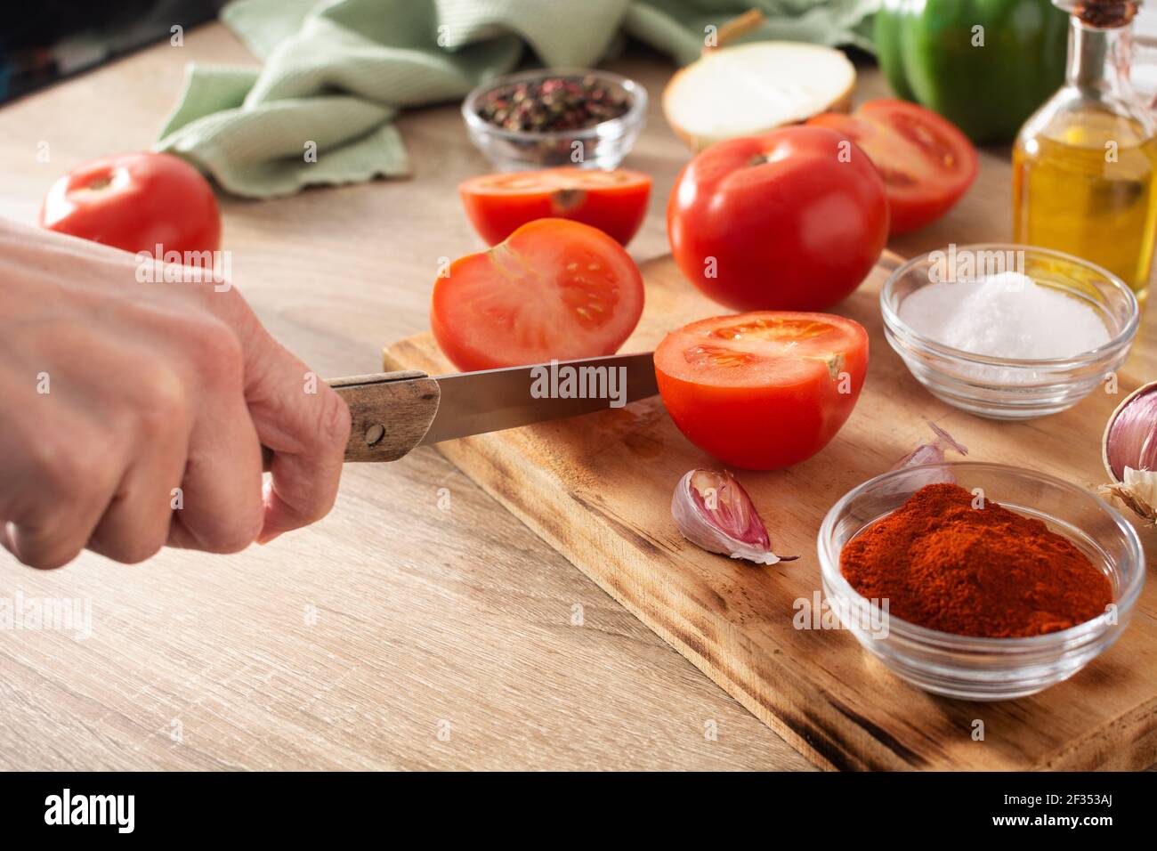 Preparing tomato sauce in the kitchen. Ingredients on the kitchen ...