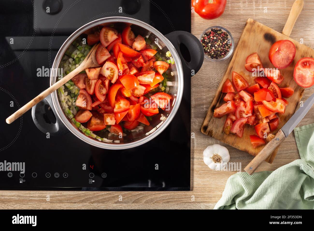 Preparing tomato sauce in the kitchen. Ingredients on the kitchen ...