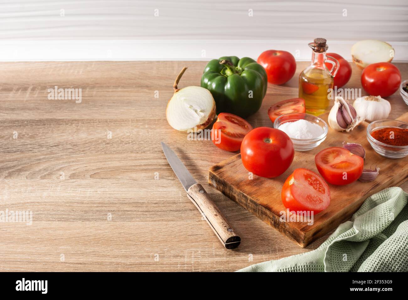 Preparing tomato sauce in the kitchen. Ingredients on the kitchen ...