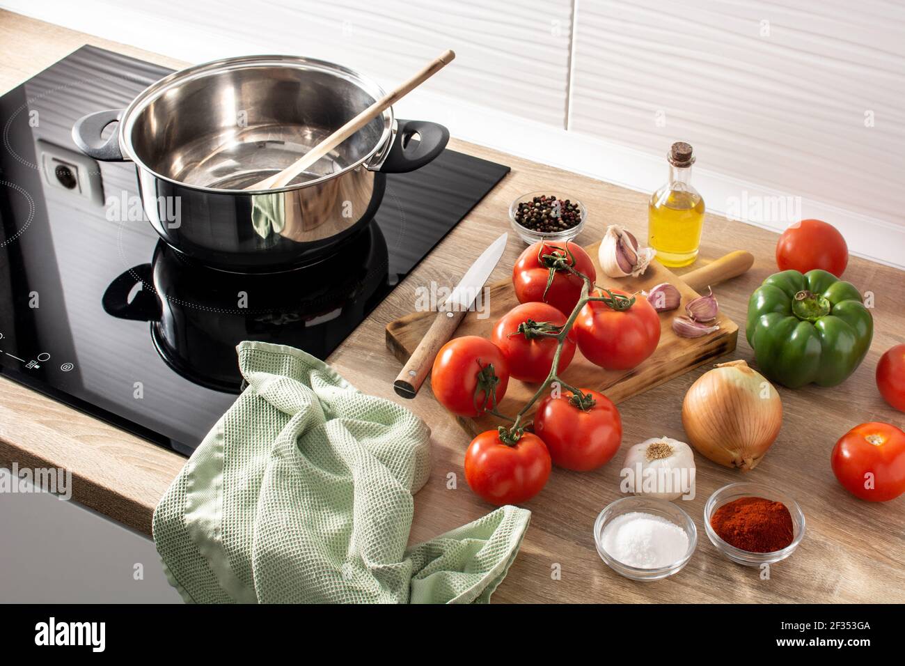 Preparing tomato sauce in the kitchen. Ingredients on the kitchen ...
