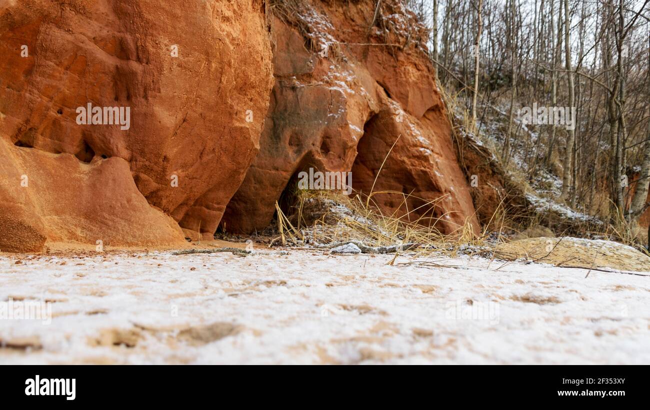 Sea cliff with Devonian sandstone outcrops. During the storm, niches ...