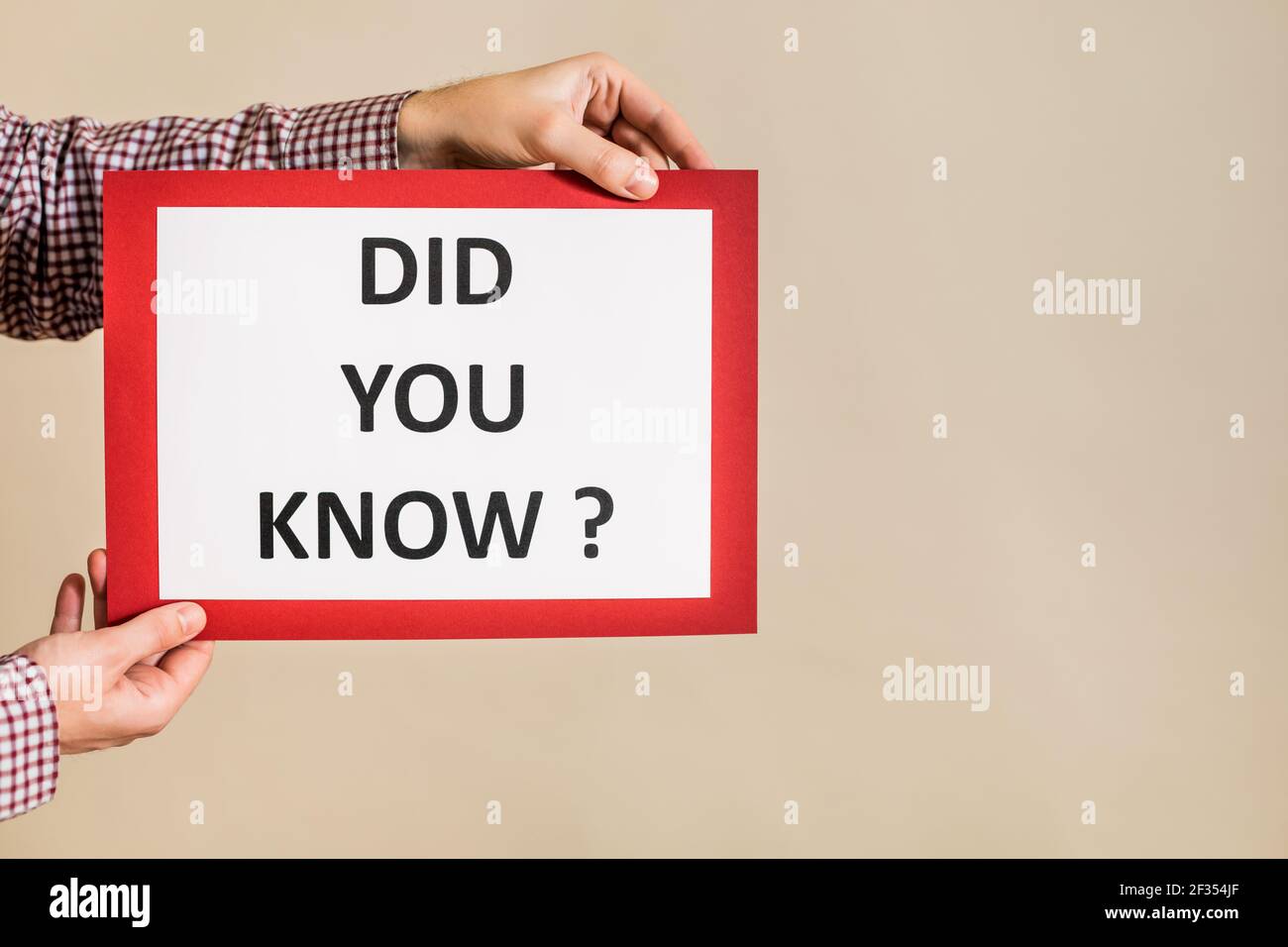 Image of man holding paper with text did you know Stock Photo - Alamy