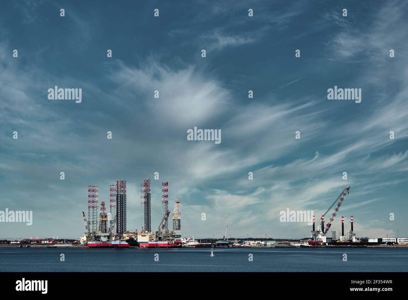 Oil and Wind power rigs in Esbjerg harbor. Denmark Stock Photo - Alamy