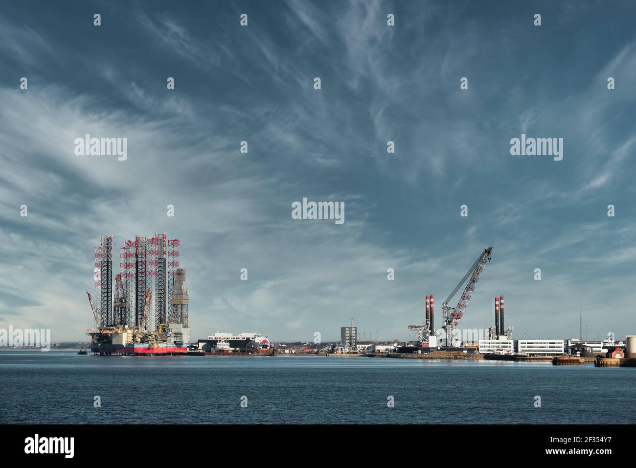 Oil and Wind power rigs in Esbjerg harbor. Denmark Stock Photo - Alamy